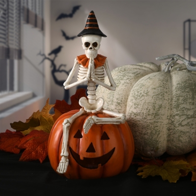 Click here for National Tree Company 12 Skeleton Sitting on Pumpk... prices
