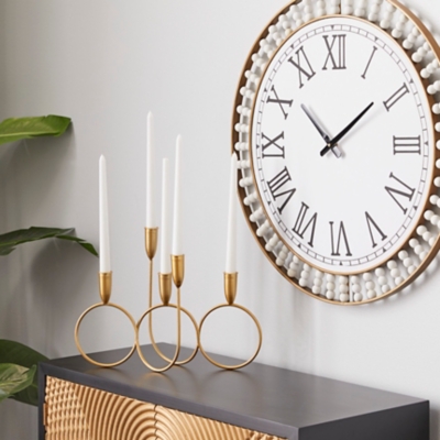 Click here for CosmoLiving by Cosmopolitan Candelabra  Gold prices