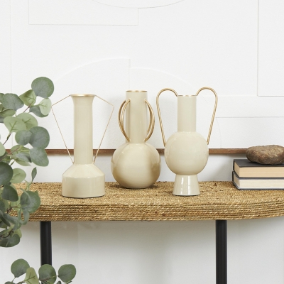 Click here for CosmoLiving by Cosmopolitan Abstract Vase with Han... prices